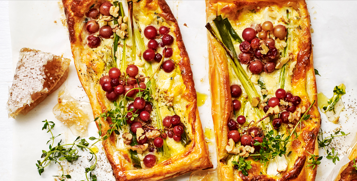 Blue cheese tarts recipe with leeks and roasted grapes | Gourmet Traveller